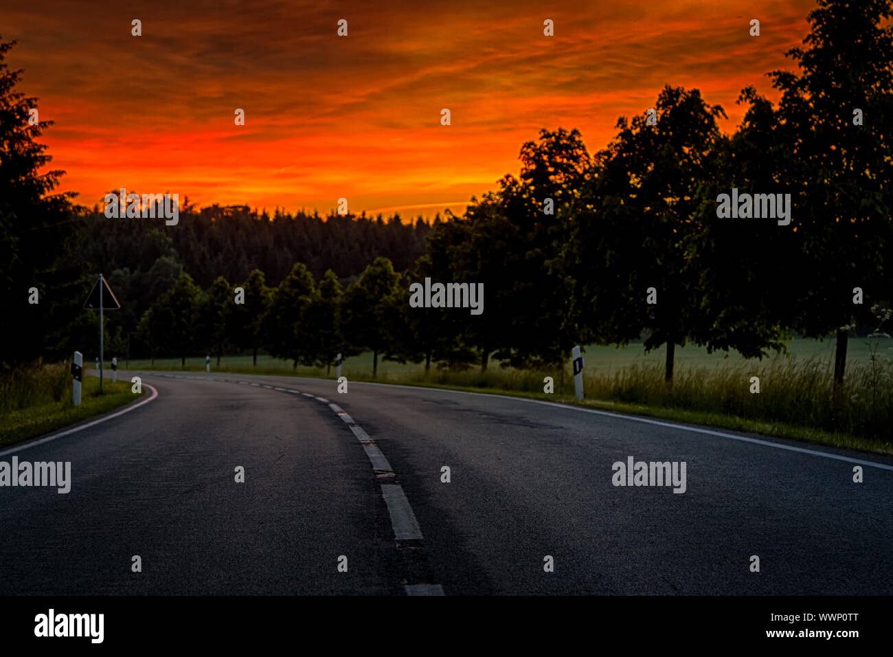 Road at sunset Stock Photo - Alamy