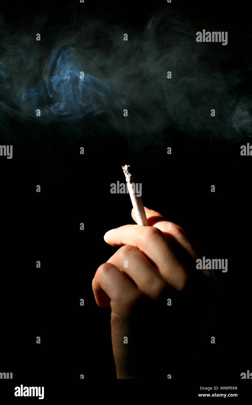 hand smoke on black background Stock Photo - Alamy