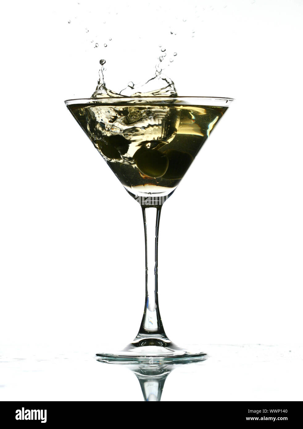 martini splash on white bar background Stock Photo - Alamy