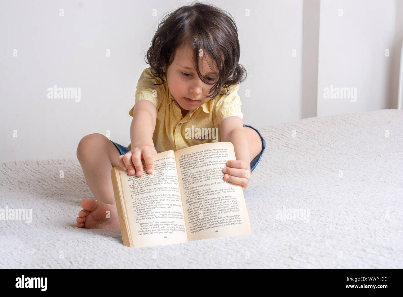 Little boy with book hand as education and studying concept Stock Photo ...