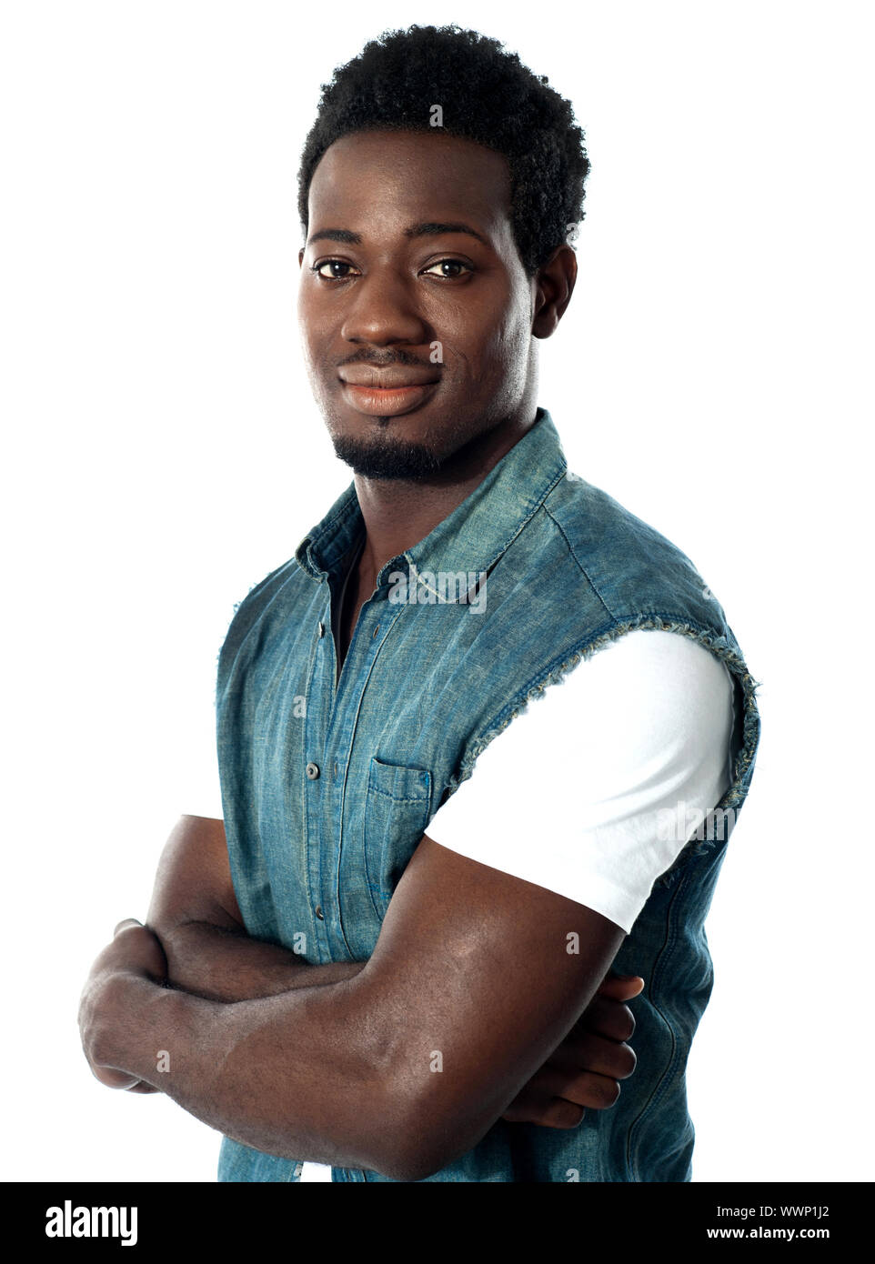 Confident african boy with folded arms against white background Stock ...