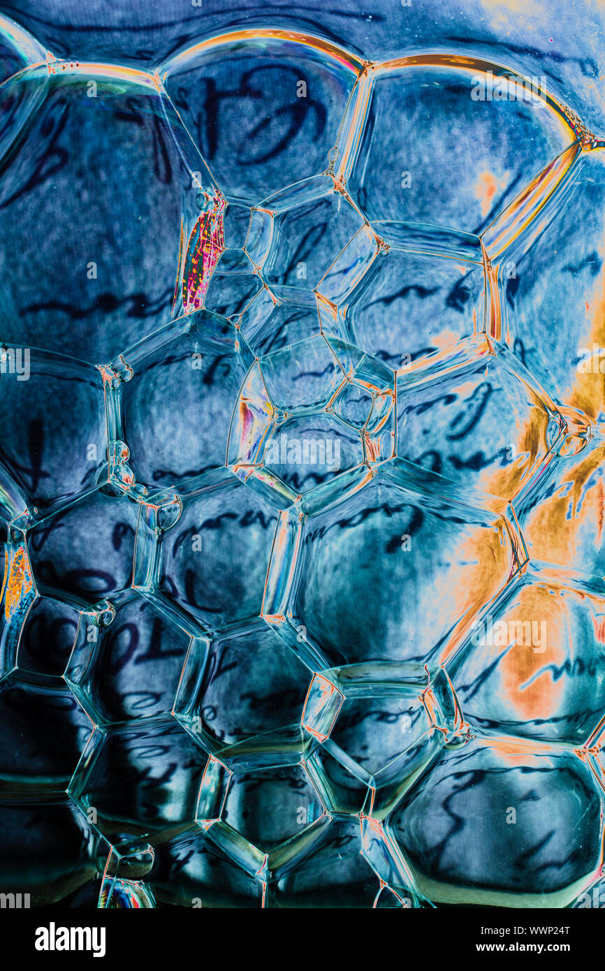 Oil bubbles inside water base form patterns Stock Photo - Alamy