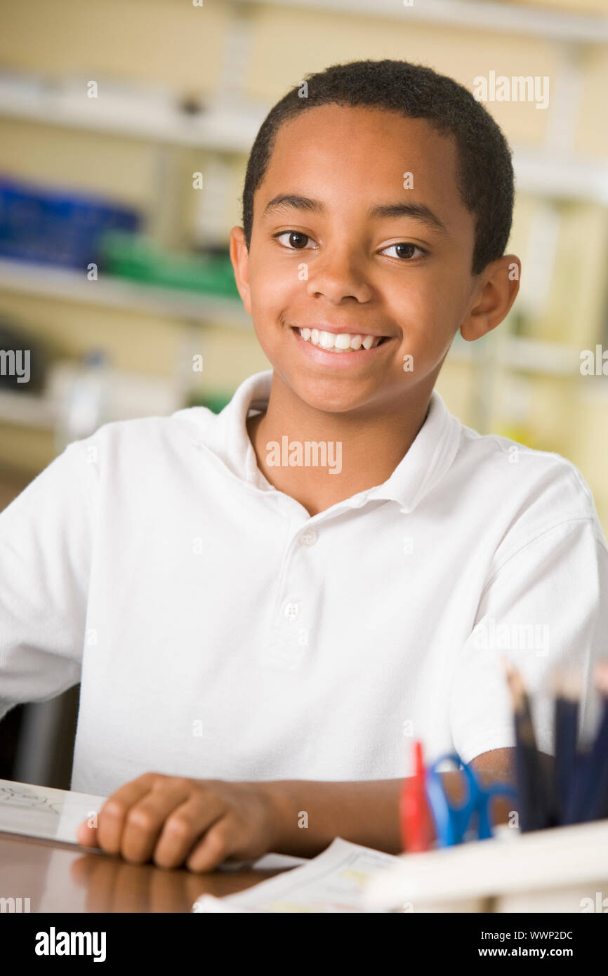 Student in class taking notes Stock Photo - Alamy