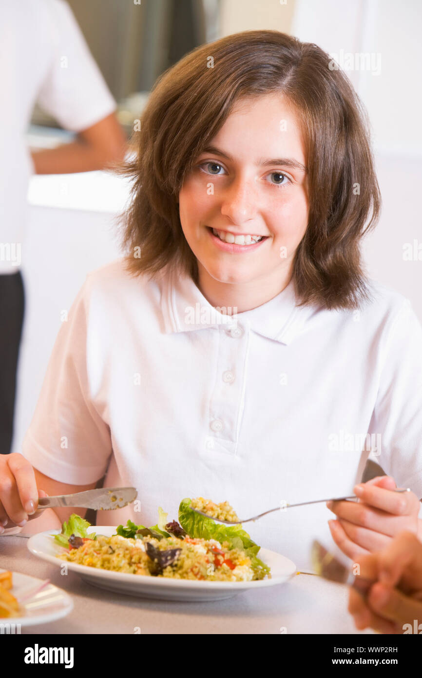 Boys eating lunch in cafeteria hi-res stock photography and images - Alamy