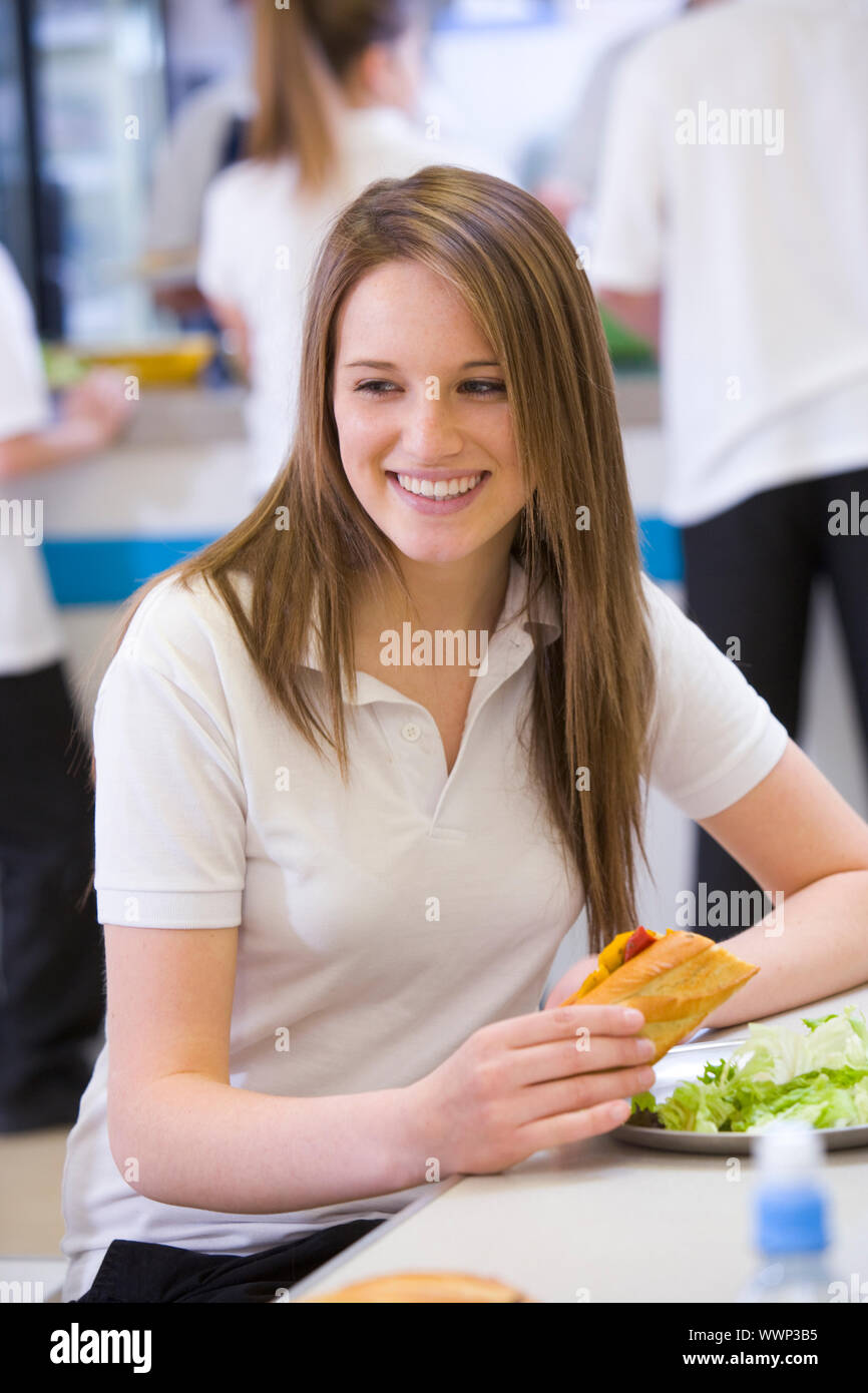 Student having lunch in dining hall Stock Photo - Alamy