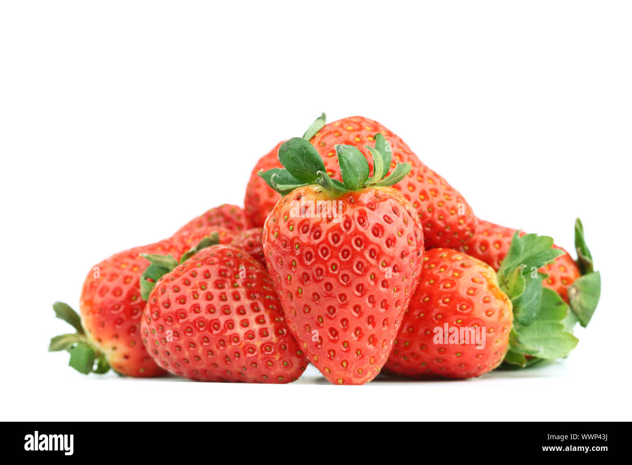 strawberry pile on white background Stock Photo - Alamy