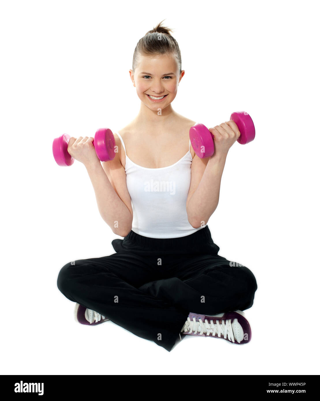 Young girl lifting weights isolated over white Stock Photo - Alamy