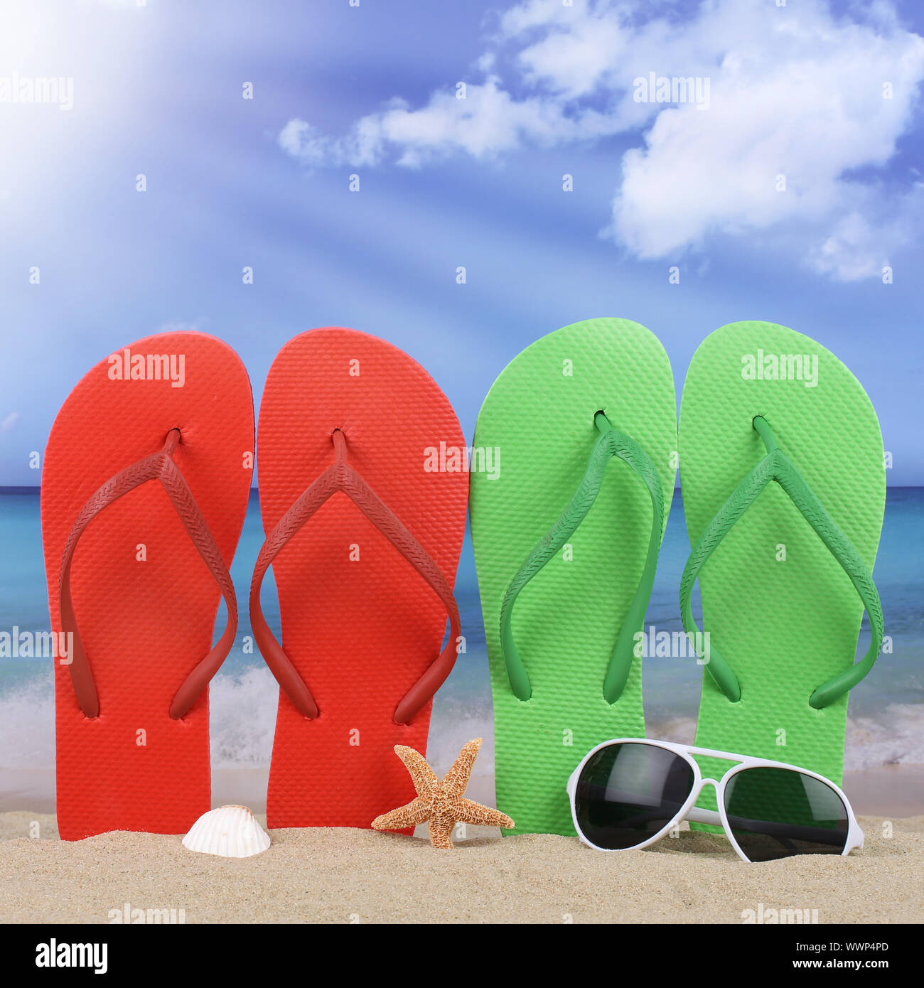 Beach scene with sandals, beach in summer and holidays Stock Photo - Alamy
