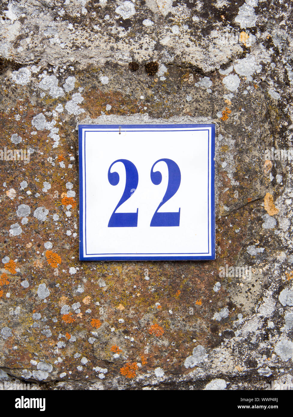 Ceramic number twenty two on the grey stone wall Stock Photo - Alamy