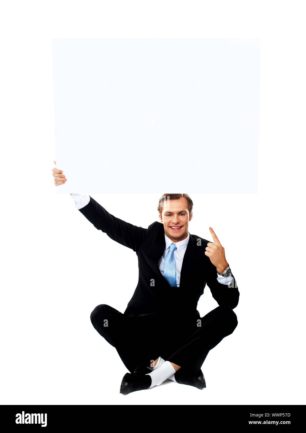 Business professional pointing up towards blank placard. Studio shot ...
