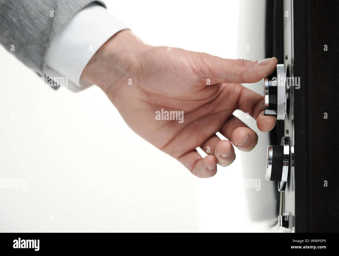 Man turning channel knob on retro television Stock Photo - Alamy