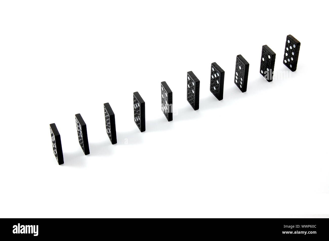 chain of dominoes isolated on a white background Stock Photo - Alamy
