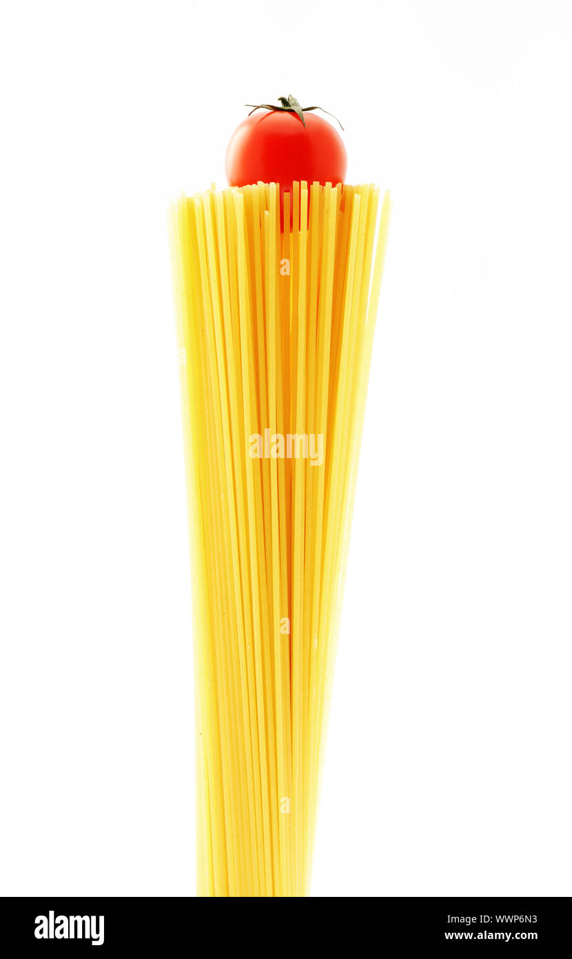 uncooked spaghetti noodles . Italian pasta with tomatoes Stock Photo ...