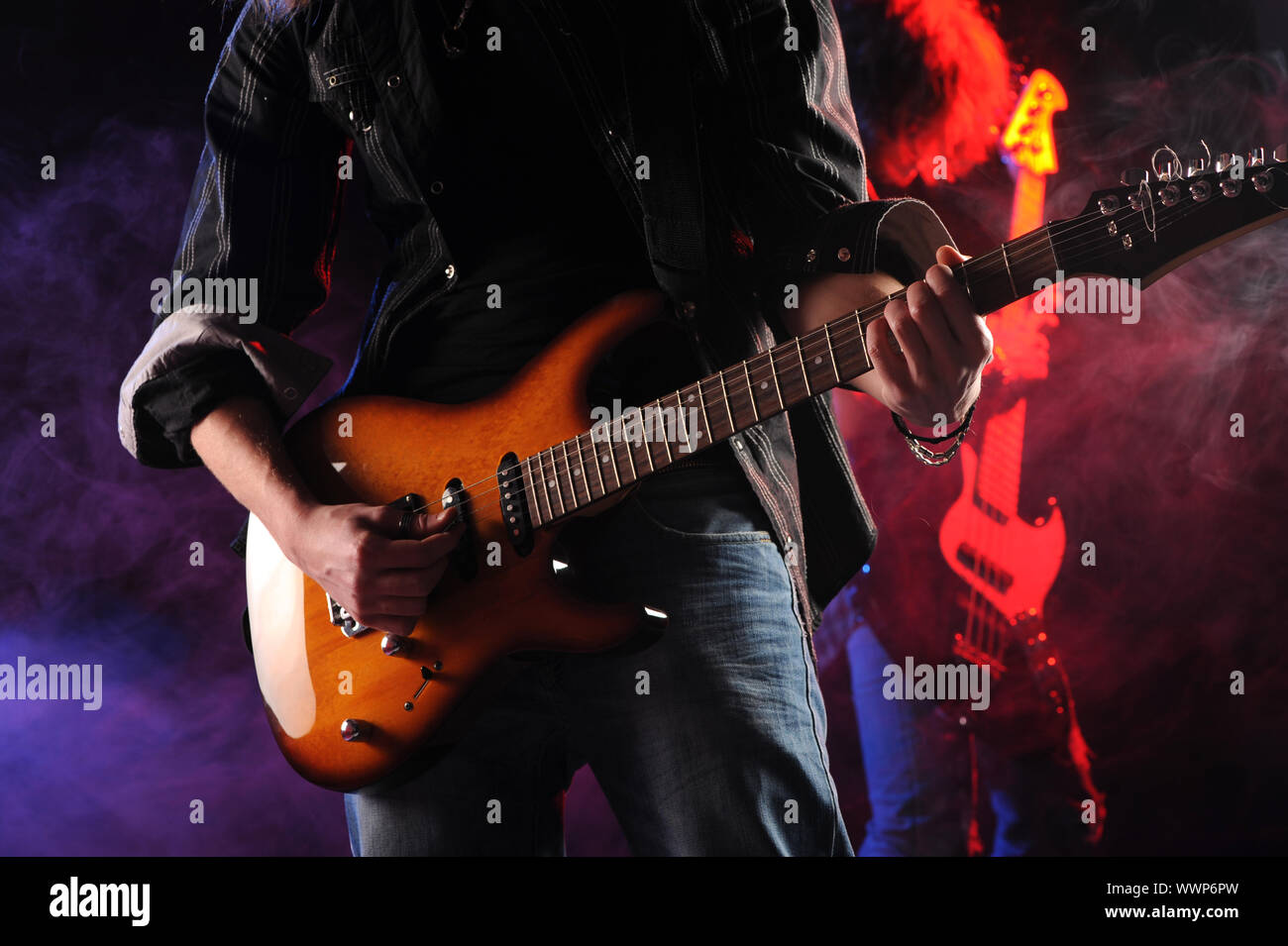 rock musicians playing at a live concert Stock Photo - Alamy