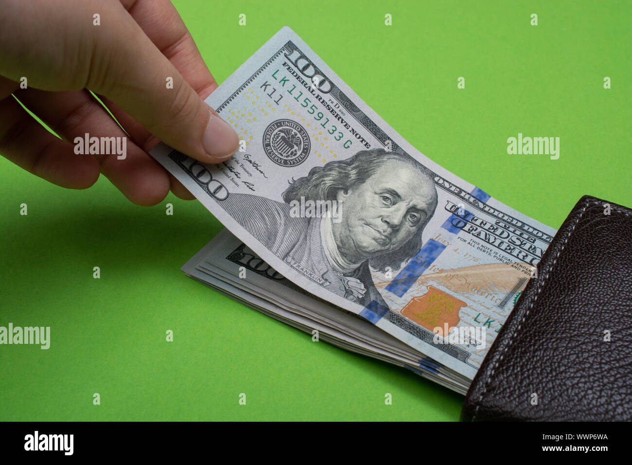 Human hand holding American dollar bill as money banknotes Stock Photo ...