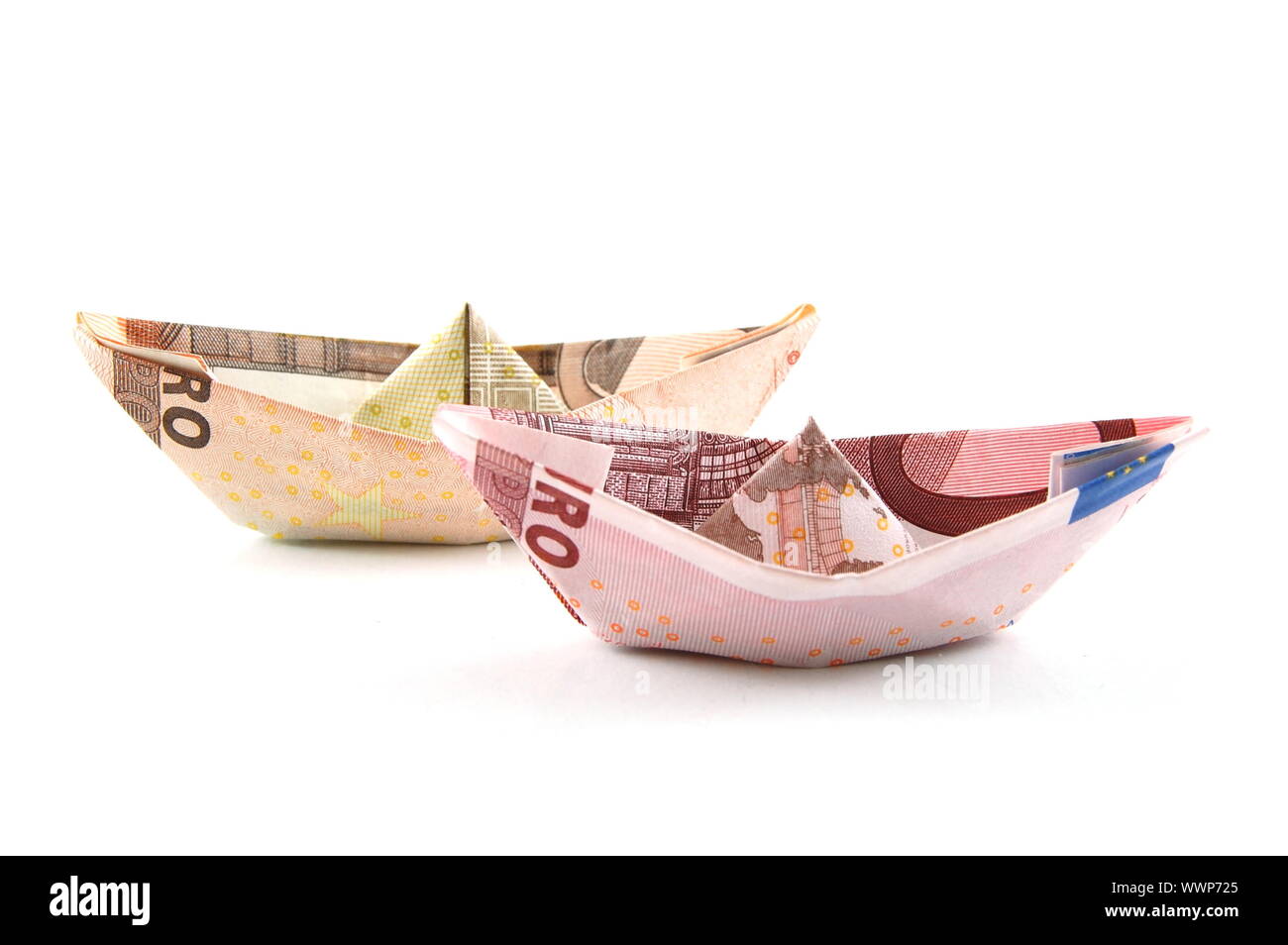 Ship made of money isolated on a white background Stock Photo - Alamy