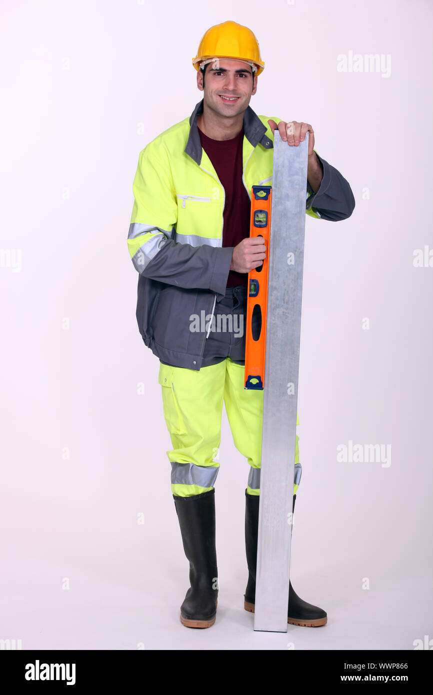 Man using spirit-level Stock Photo - Alamy