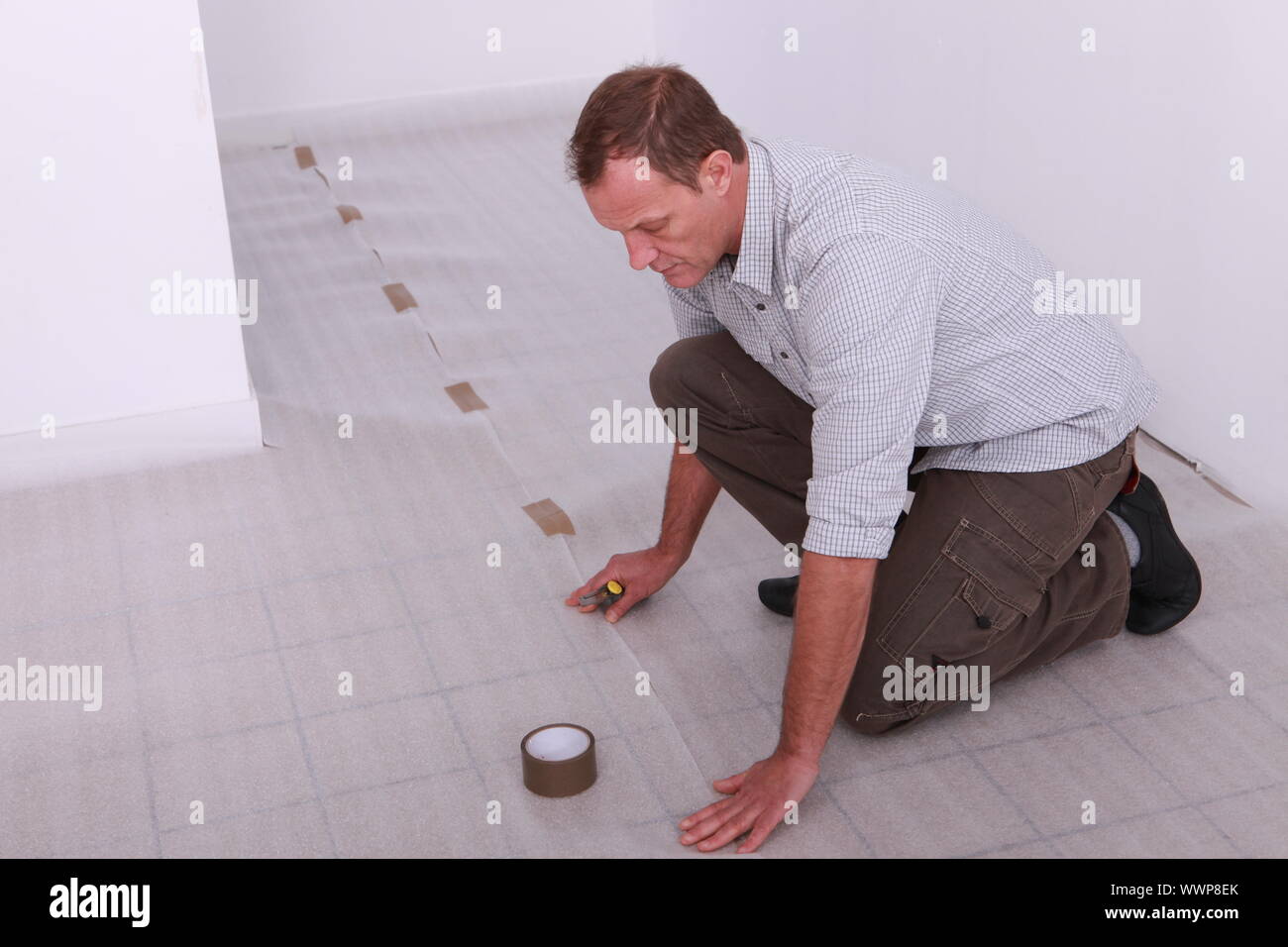 Mason fixing tiles hi-res stock photography and images - Alamy