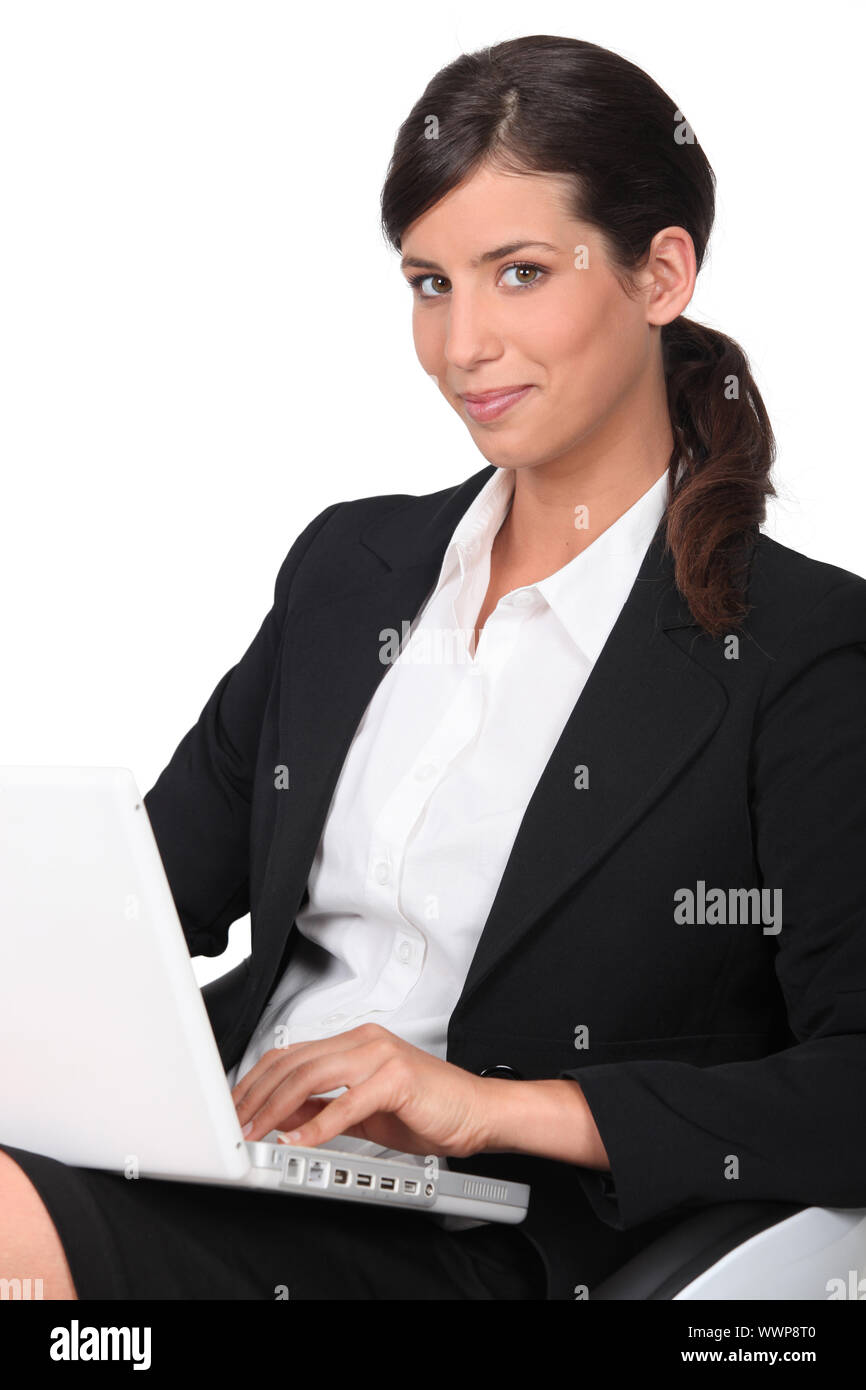 Brunette woman with computer Stock Photo - Alamy