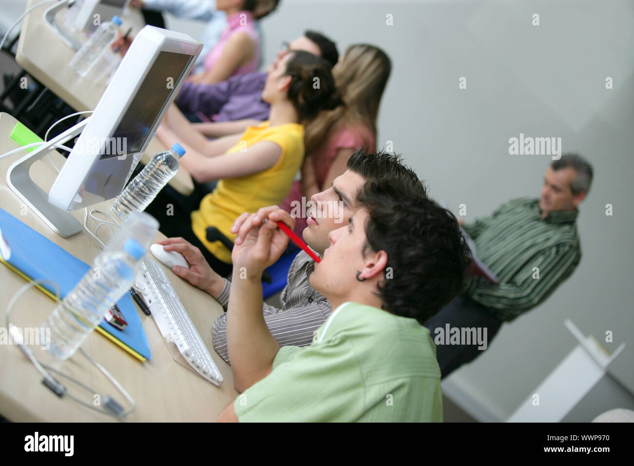 Young men in a classroom Stock Photo - Alamy