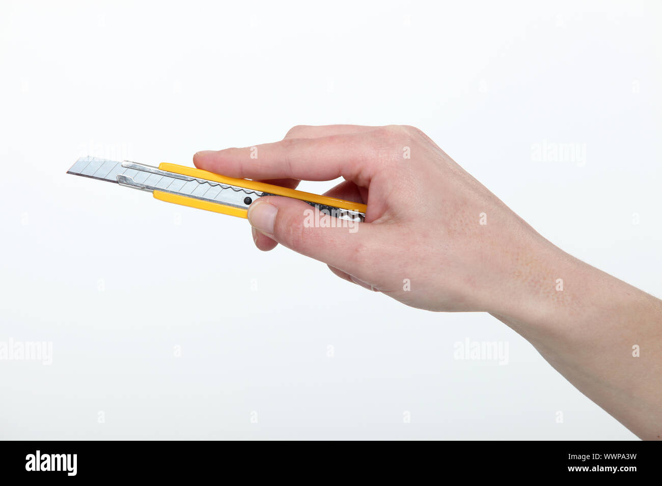 hand holding a cutter Stock Photo - Alamy