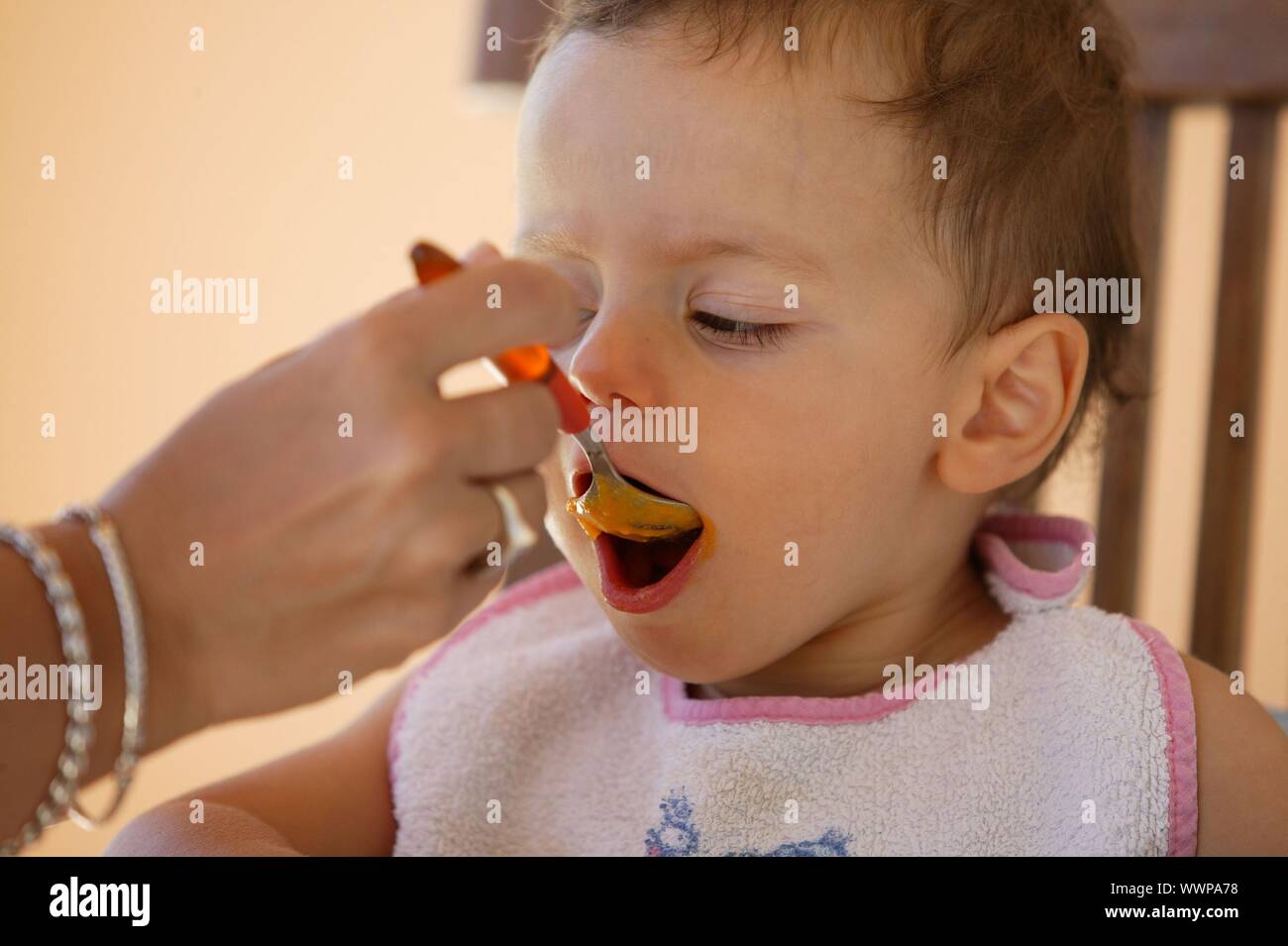 little boy eating with a spoon Stock Photo - Alamy