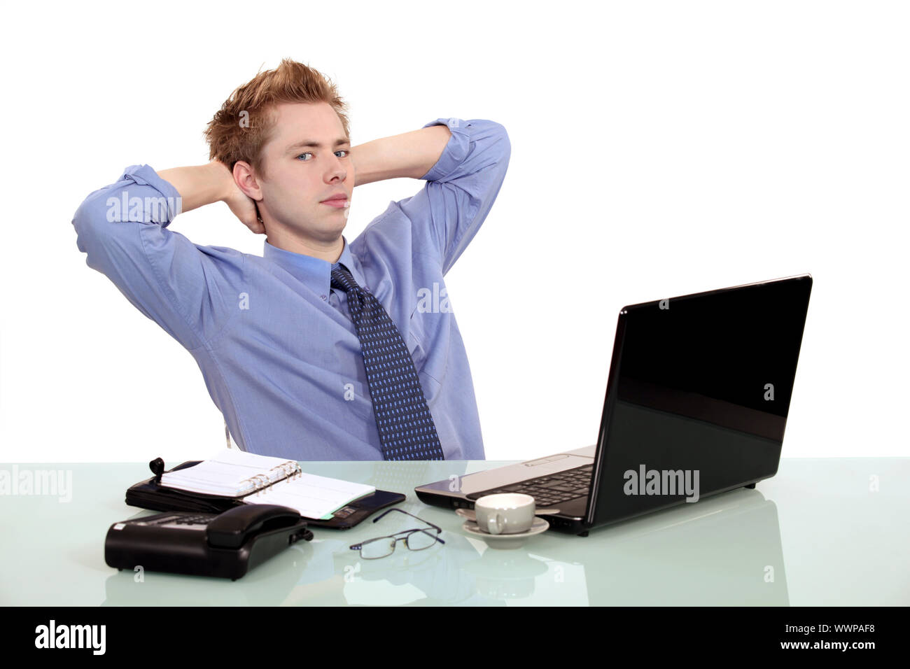 Young banker in front of a computer Stock Photo - Alamy