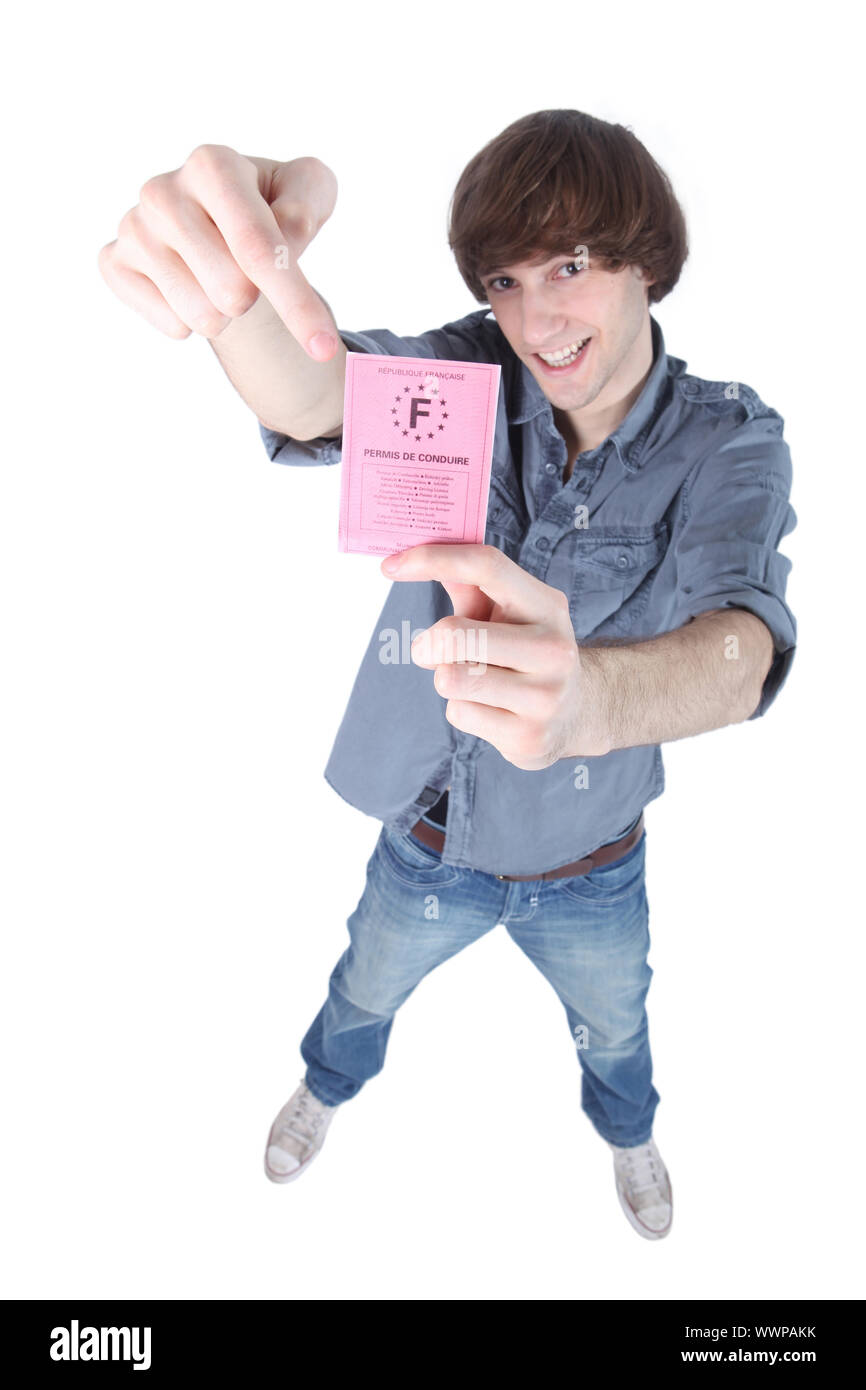 Young man pointing to driving license Stock Photo - Alamy