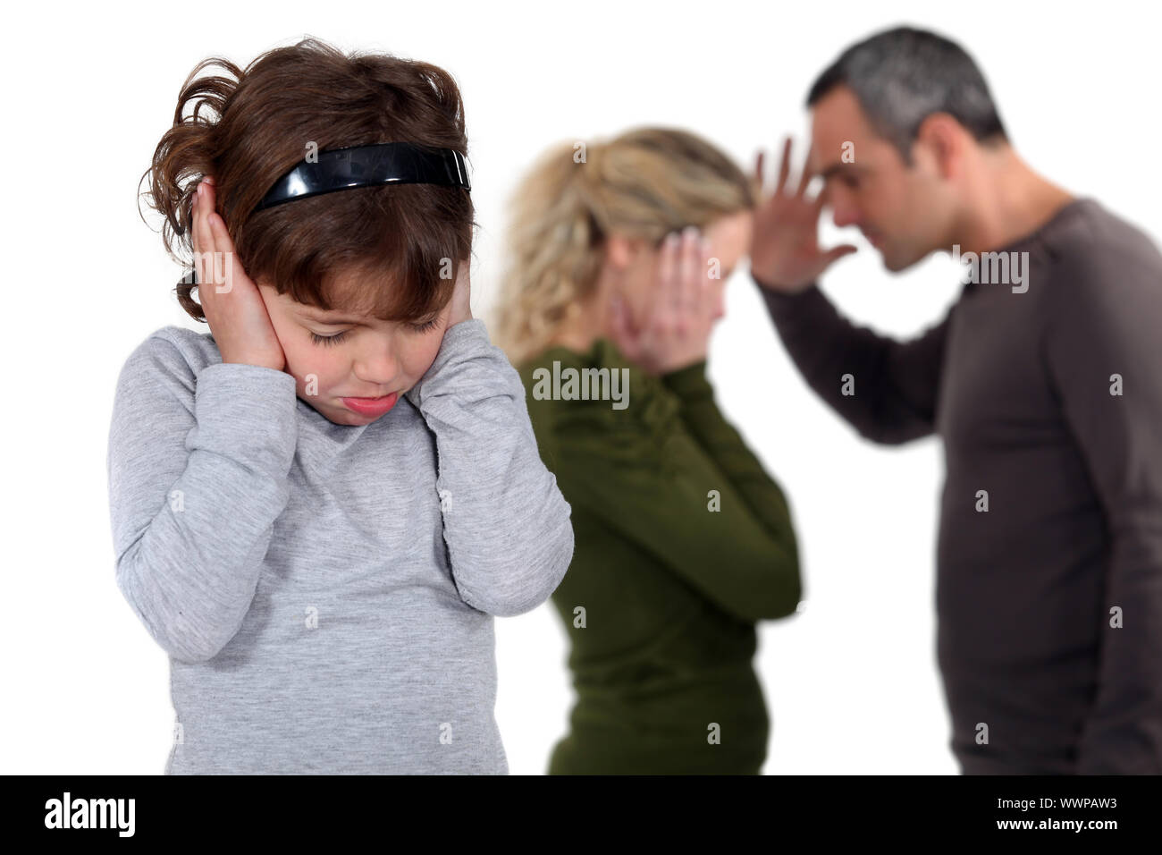 Daughter stood with arguing parents Stock Photo - Alamy