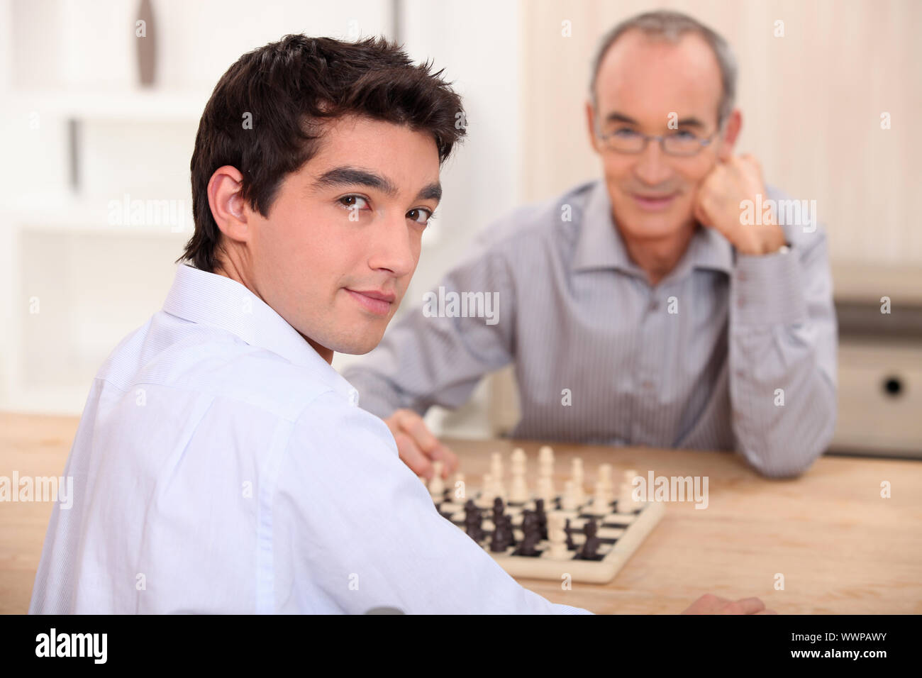 Grandpa playing chess board game hi-res stock photography and images ...