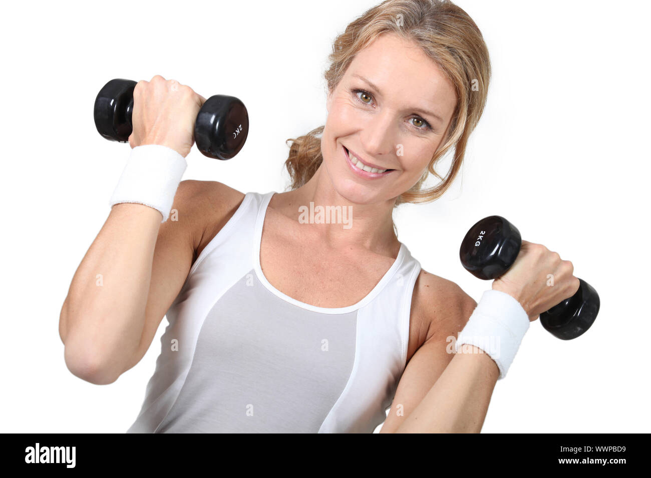 Woman lifting weights Stock Photo - Alamy