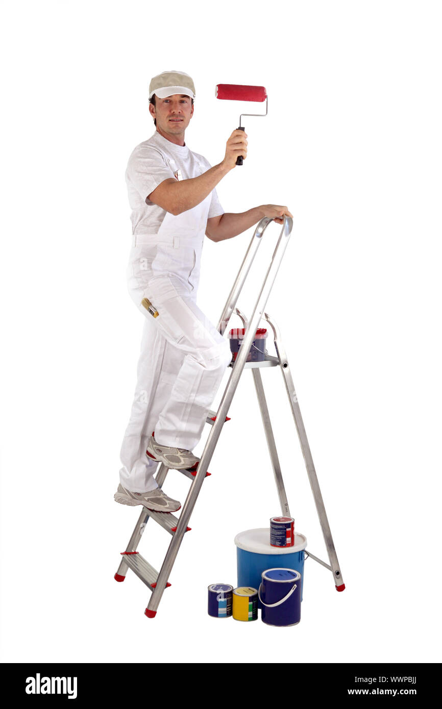 Decorator painting wall red Stock Photo - Alamy