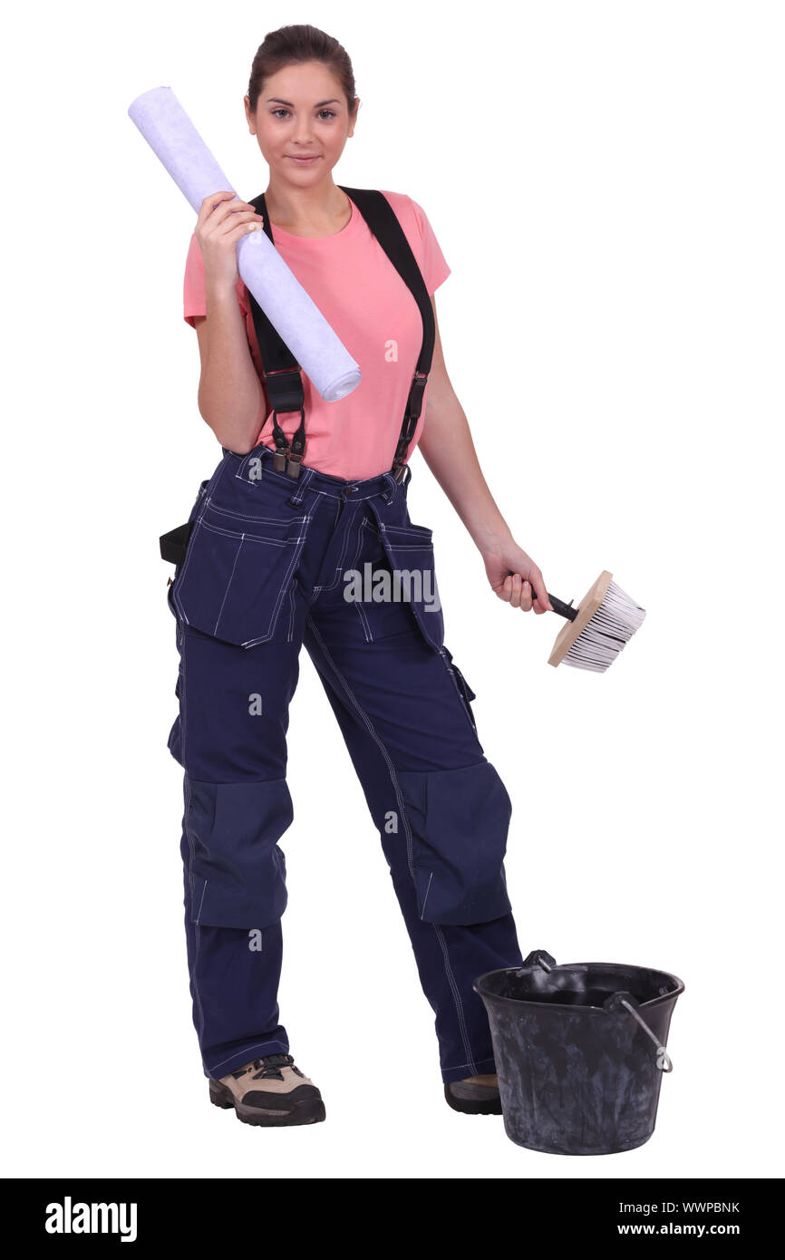 Woman putting up wallpaper Stock Photo - Alamy