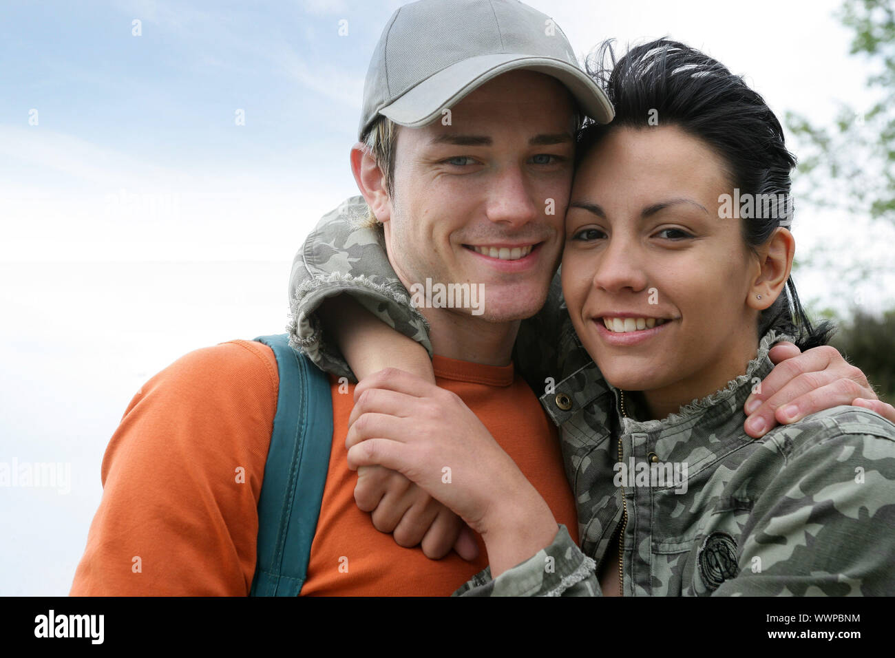 Affectionate couple having a cuddle outdoors Stock Photo - Alamy