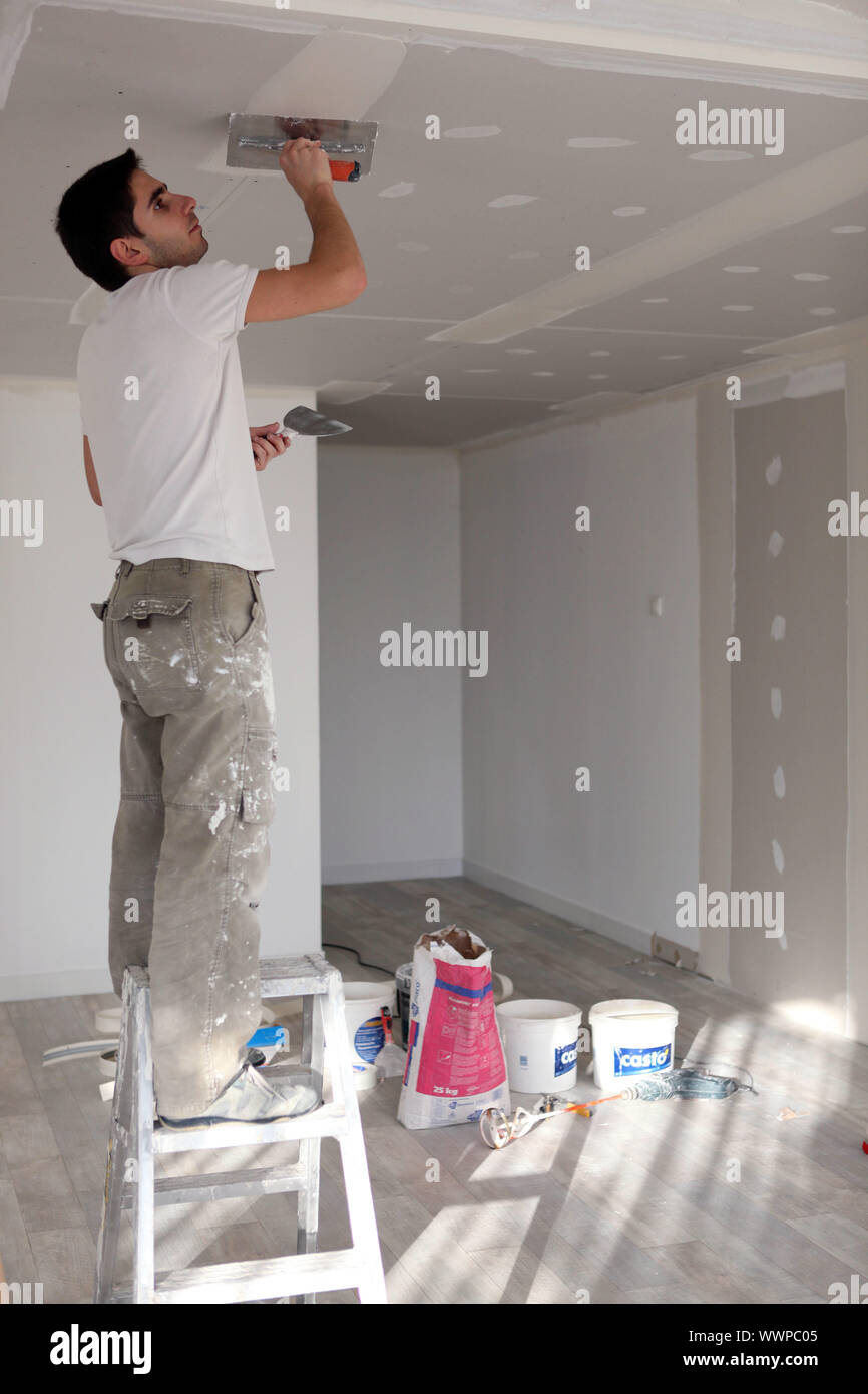 craftsman painting the ceiling Stock Photo - Alamy