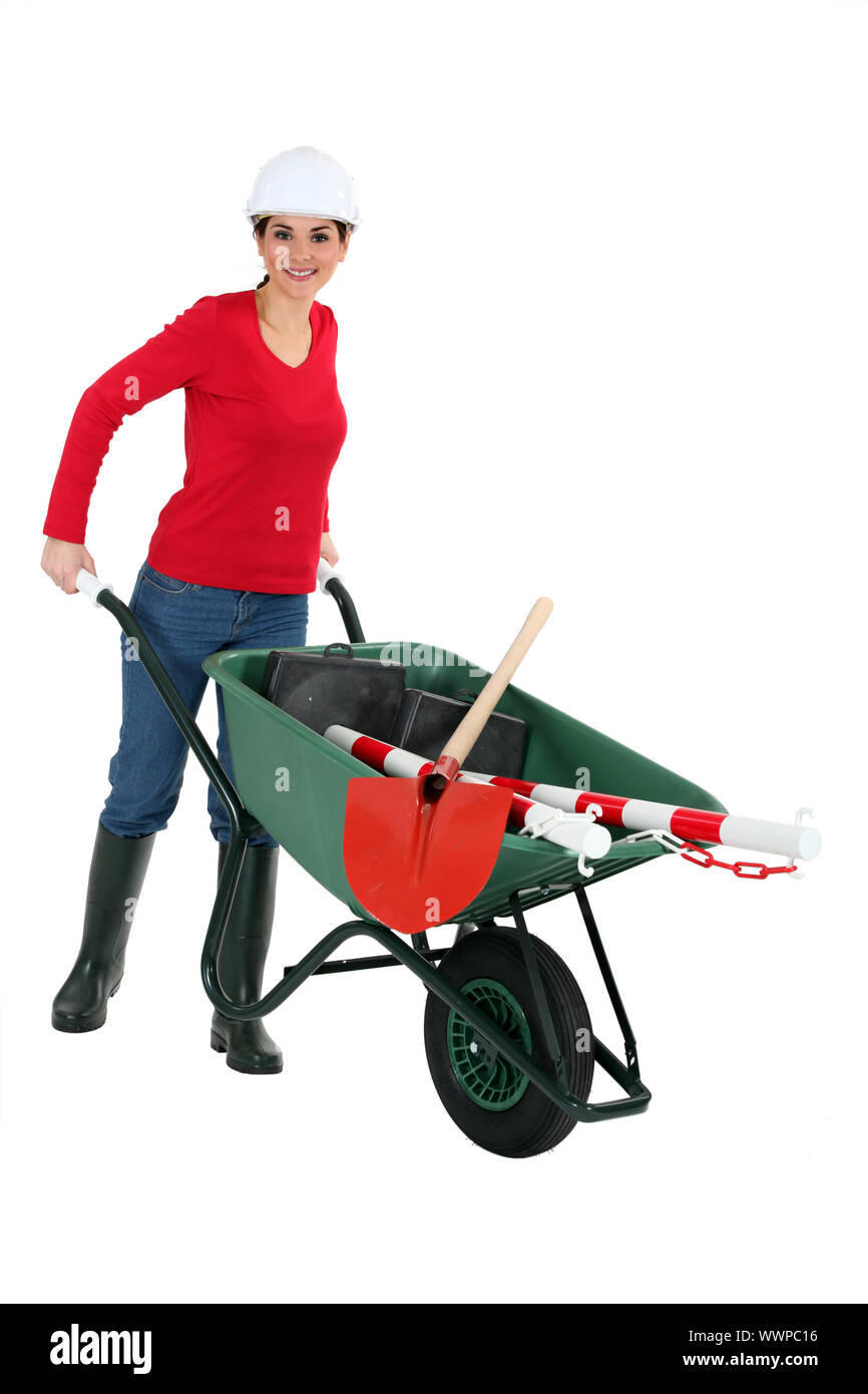 craftswoman transporting instruments with a wheelbarrow Stock Photo - Alamy