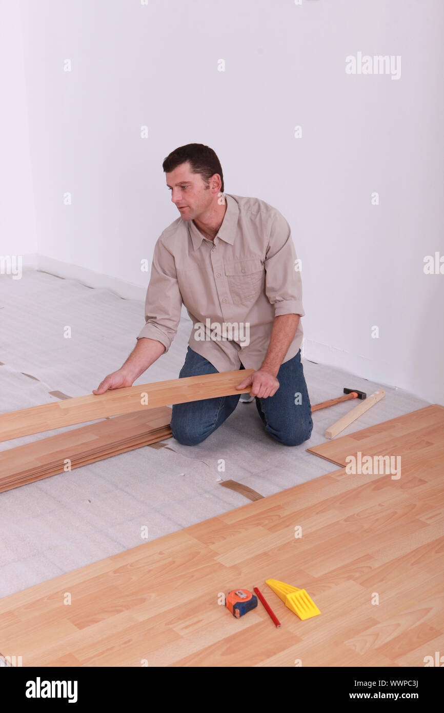 Man laying wooden Stock Photo - Alamy