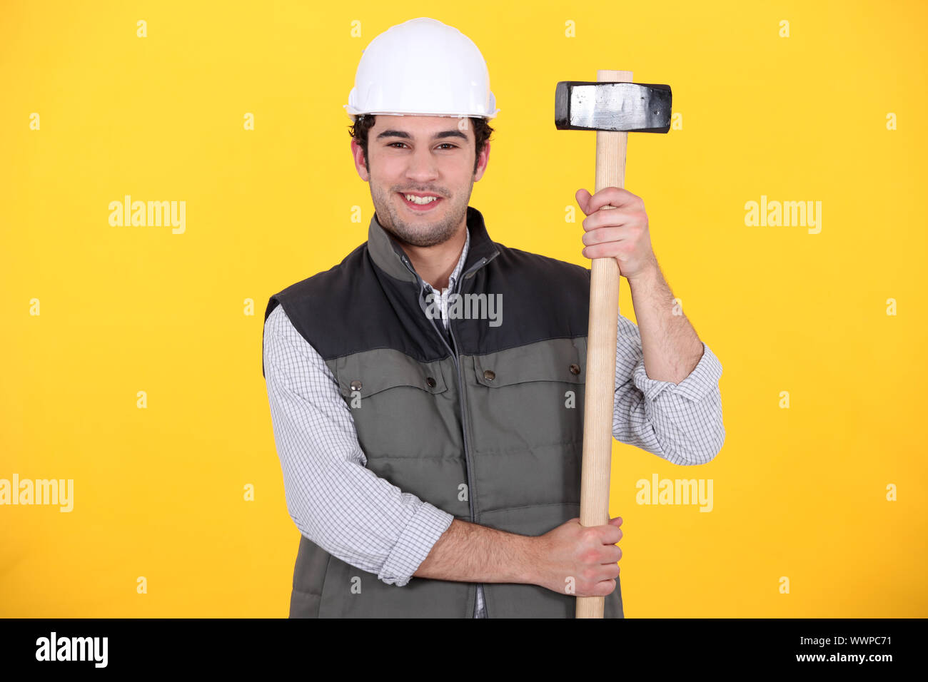 craftsman holding a huge hammer Stock Photo - Alamy