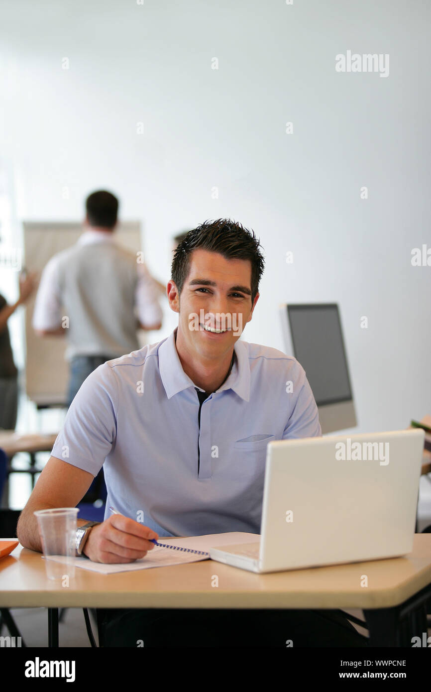 Man happily working desk hi-res stock photography and images - Alamy