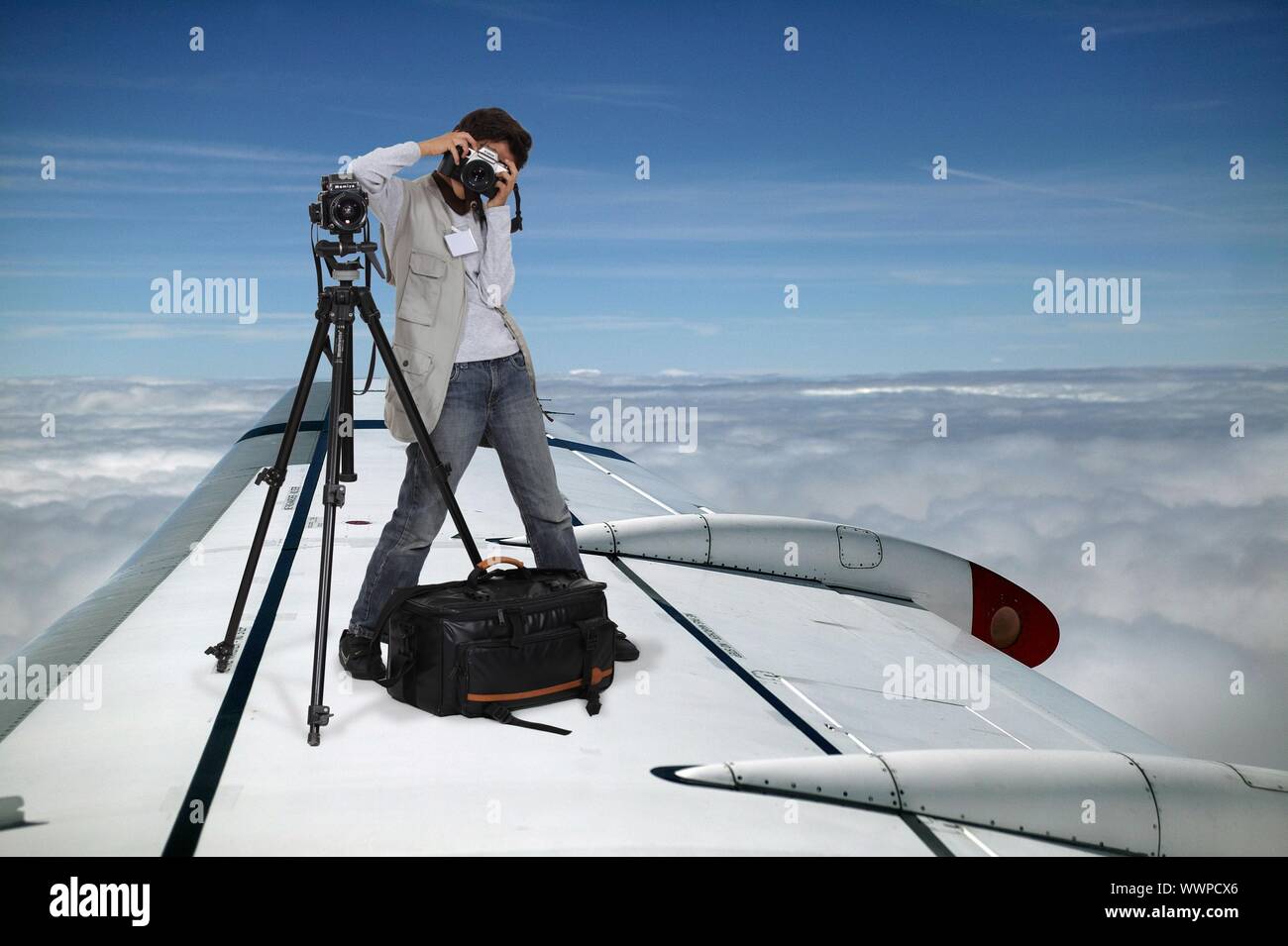 photographer flying on a plane wing Stock Photo - Alamy