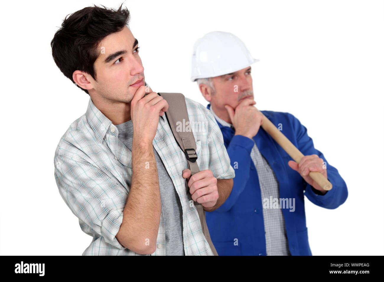 Builder stood with young apprentice Stock Photo - Alamy