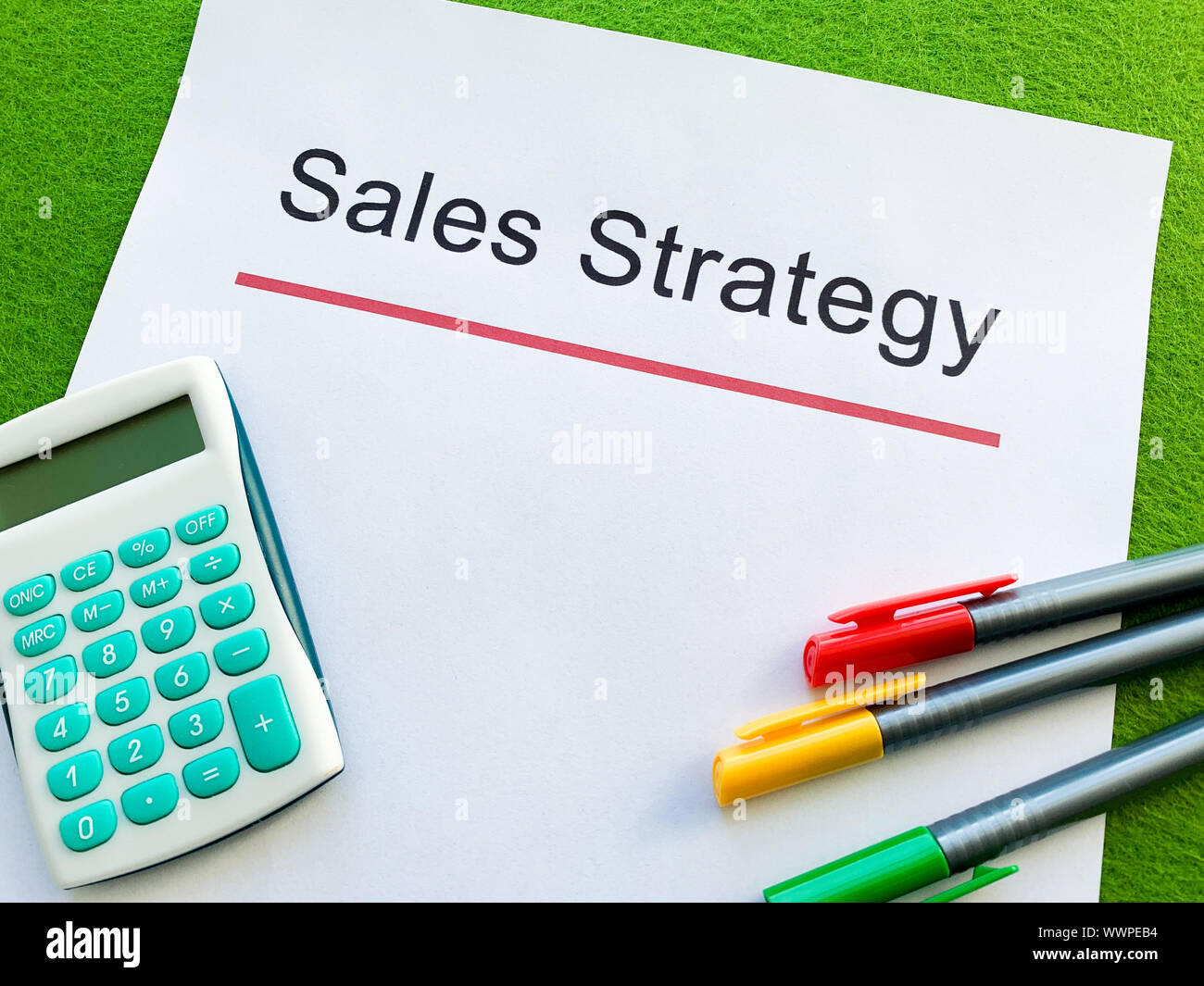 Paper with text sales strategy on green background Stock Photo - Alamy