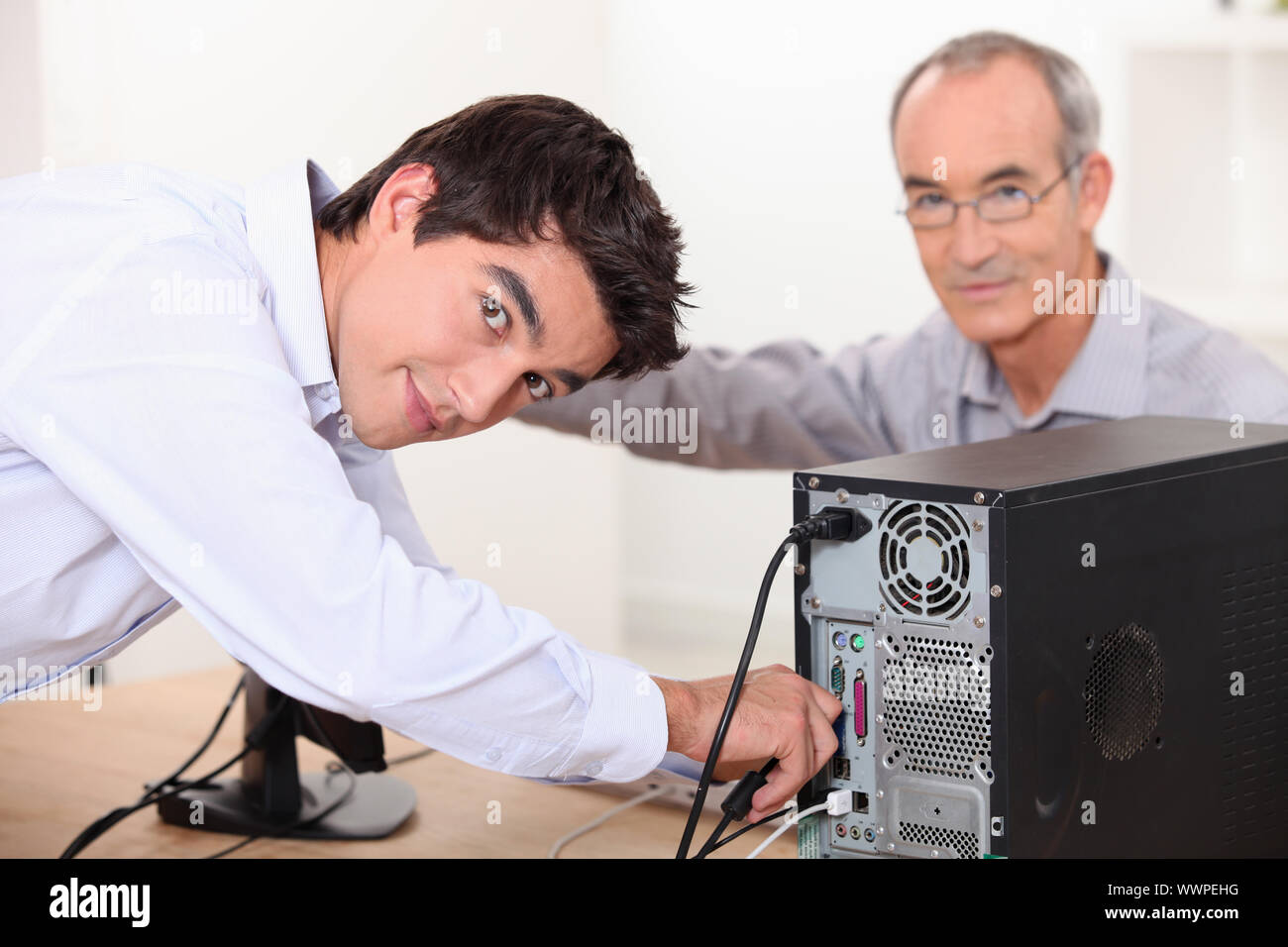 Technician repairing computer Stock Photo - Alamy