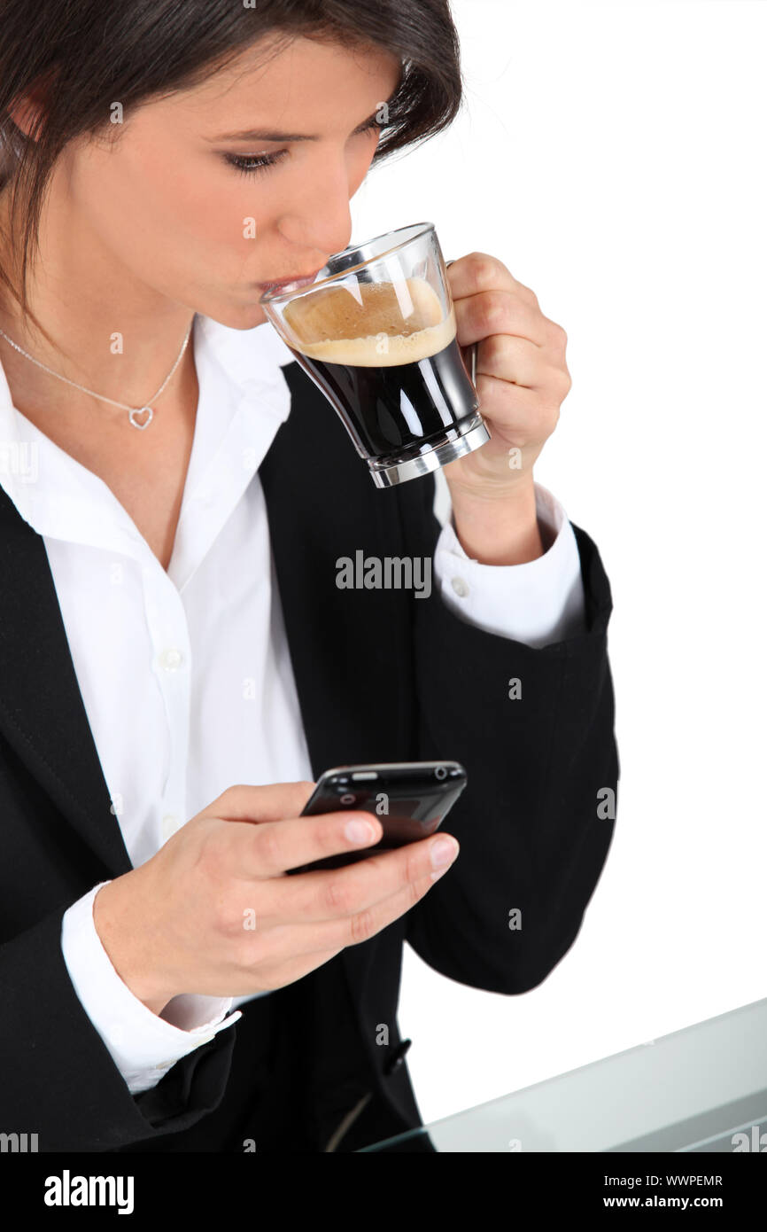 Woman with telephone and coffee Stock Photo - Alamy