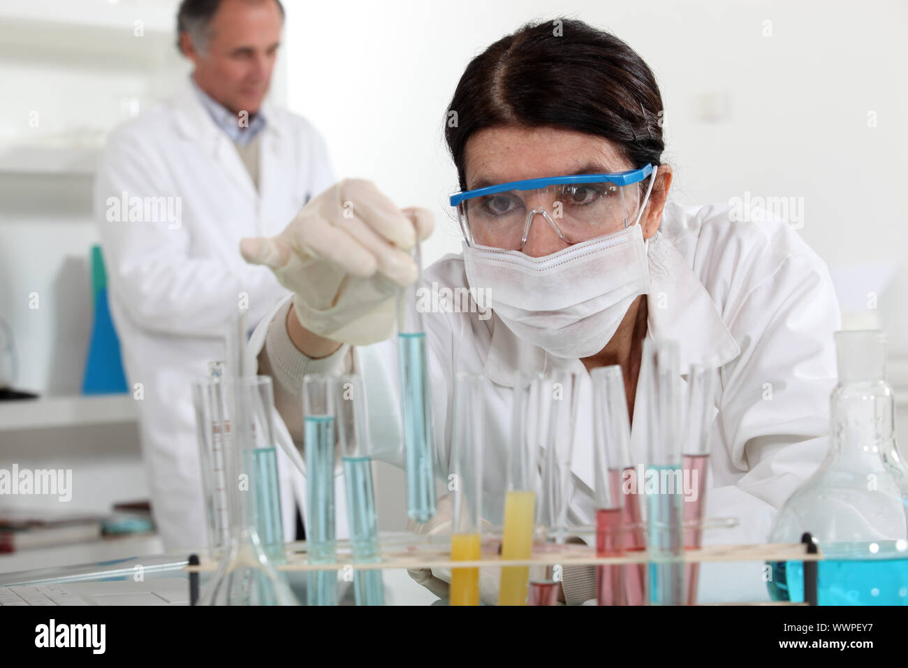 Scientists conducting an experiment Stock Photo - Alamy