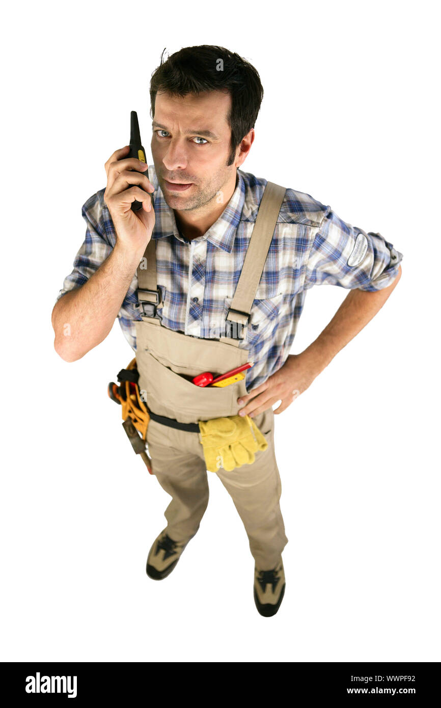 Builder using radio Stock Photo - Alamy