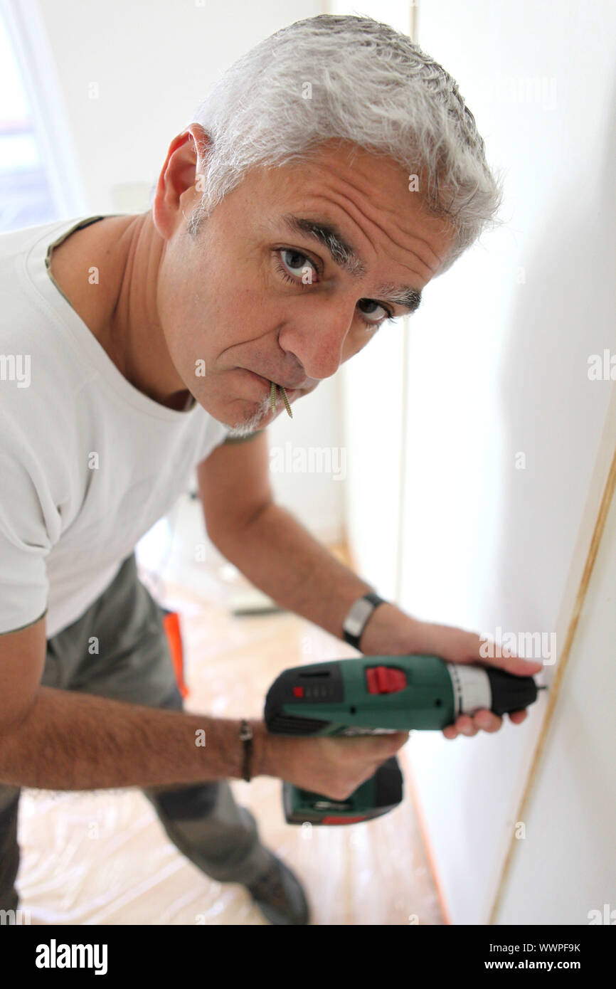 Man using an cordless screwdriver Stock Photo - Alamy