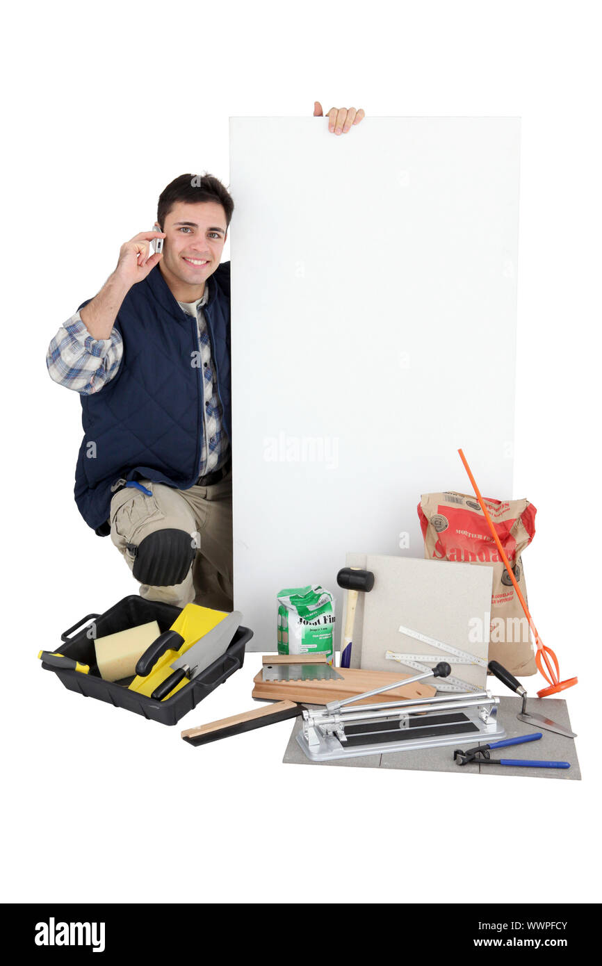 craftsman holding an ad board and talking on the phone Stock Photo - Alamy