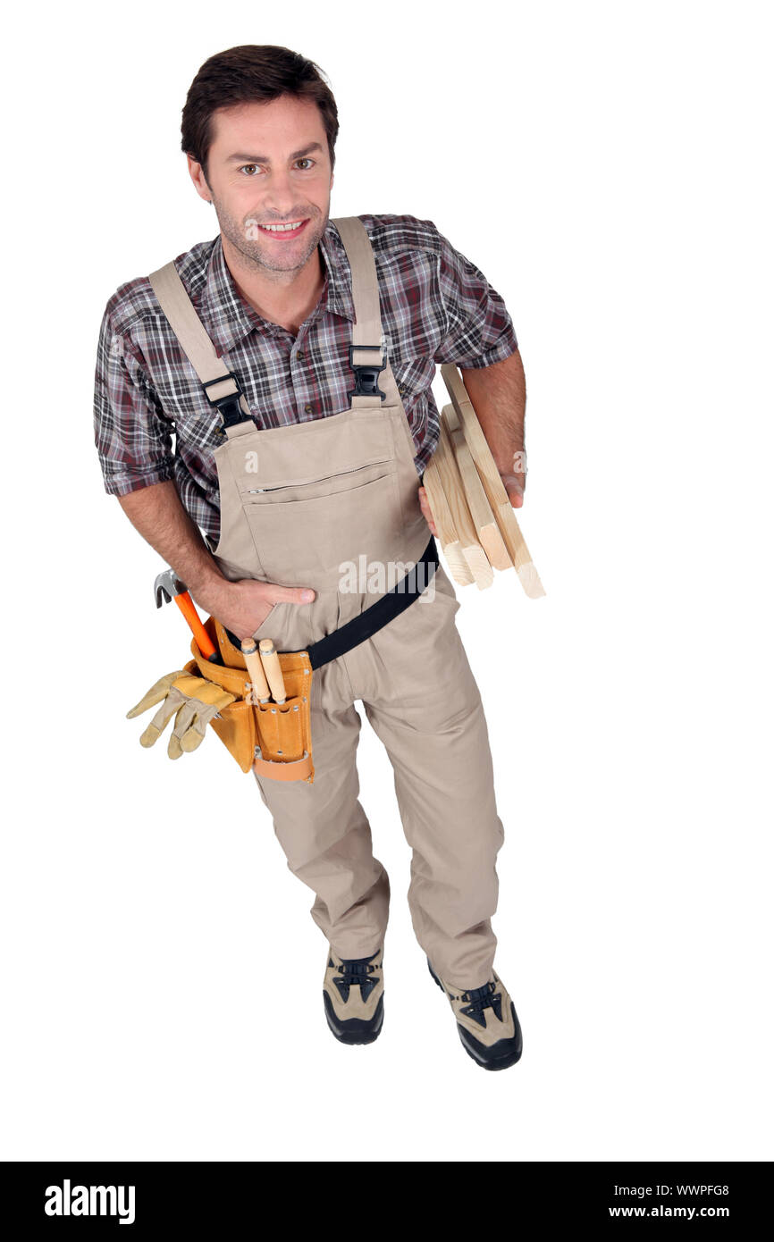 Happy builder with tools Stock Photo - Alamy
