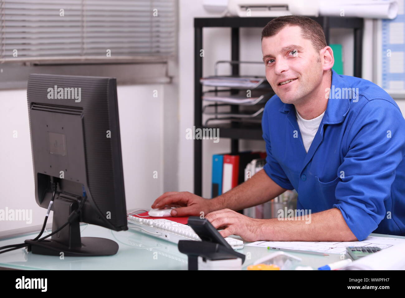 factory worker in his office Stock Photo - Alamy